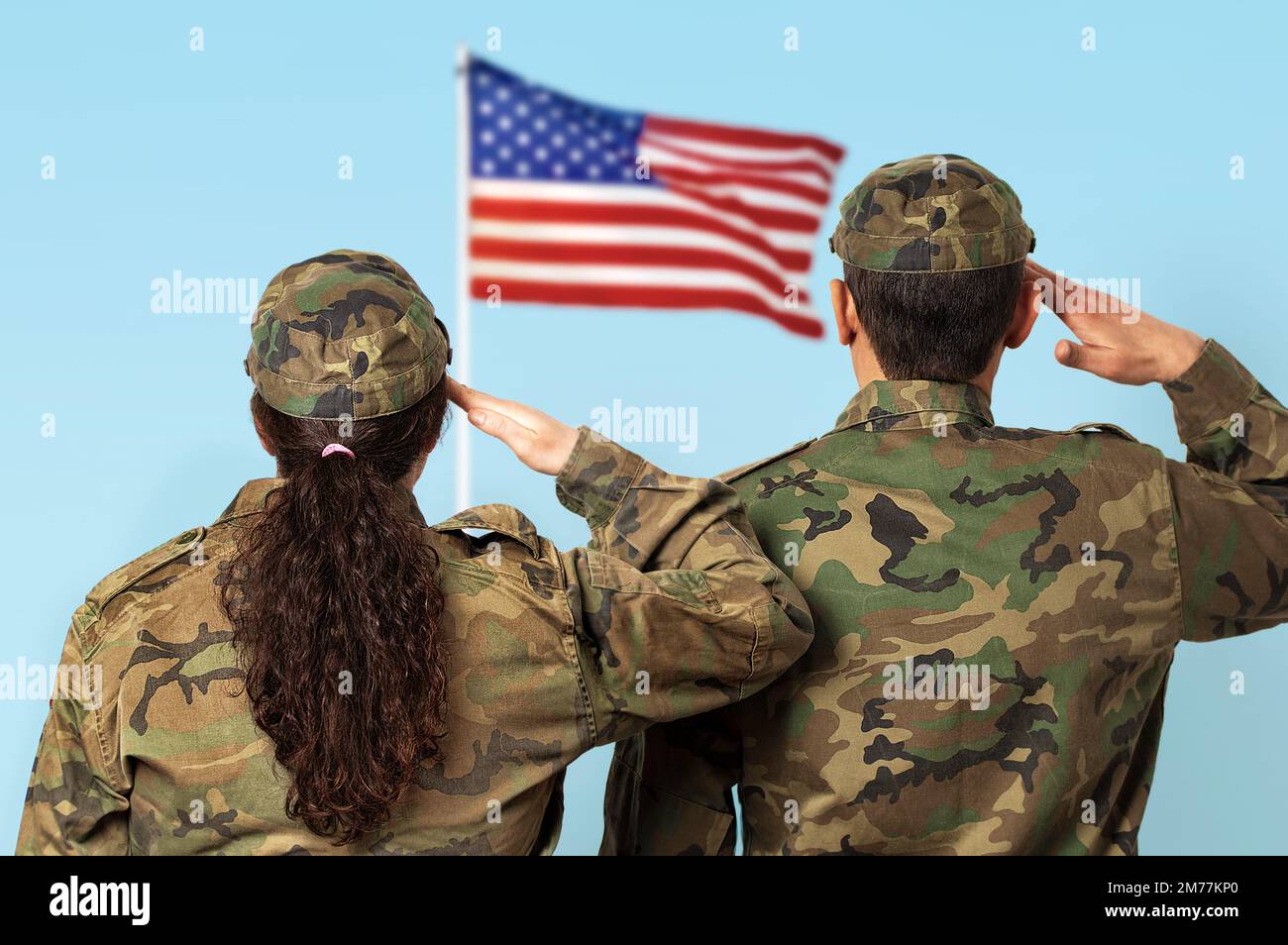 Rear view shot of two US soldiers saluting the US flag Stock Photo - Alamy