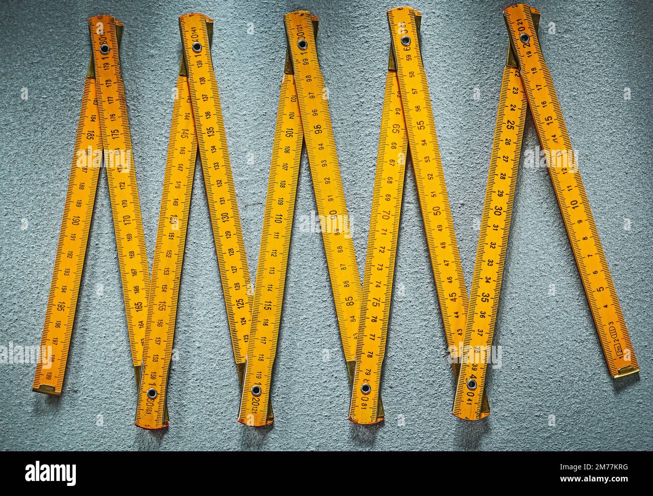 Wooden meter on concrete background construction concept Stock Photo ...