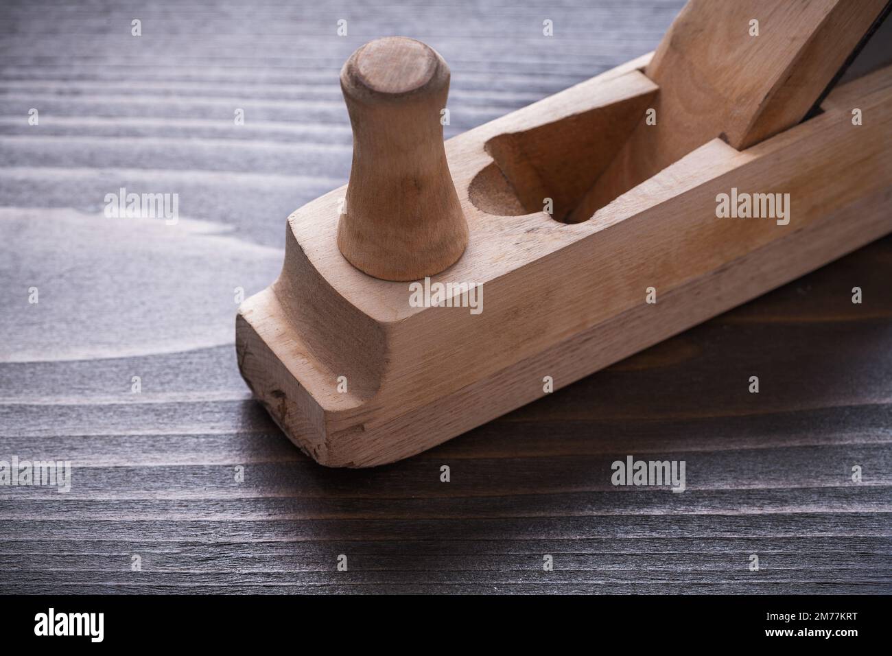 Wooden planer on vintage wood board close up construction concept Stock ...