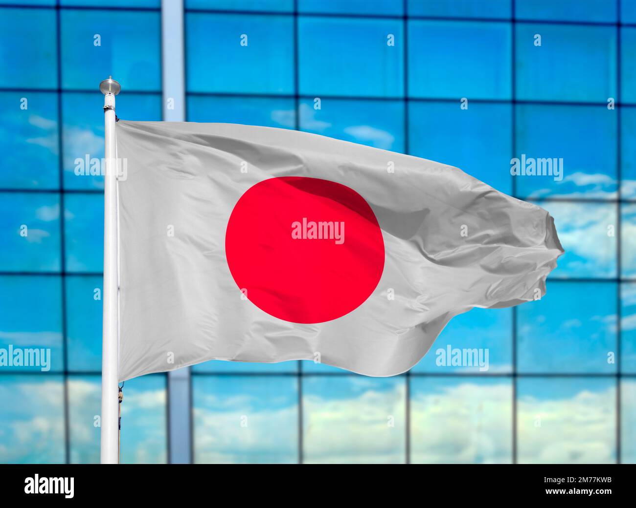 Close-up of flag of Japan on skyscraper building background Stock Photo ...