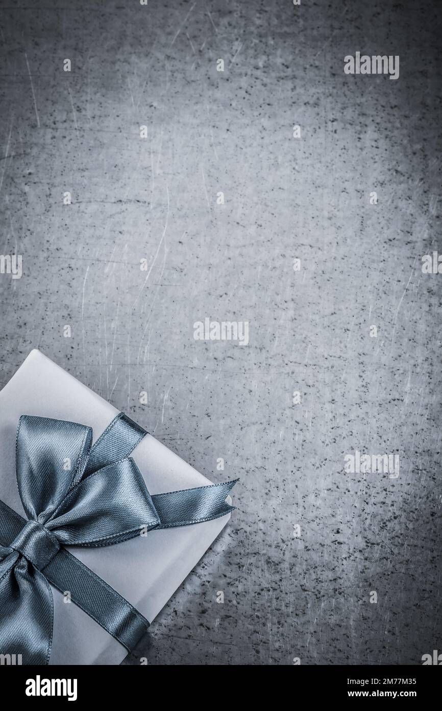 Wrapped gift box on metallic background celebrations concept Stock ...