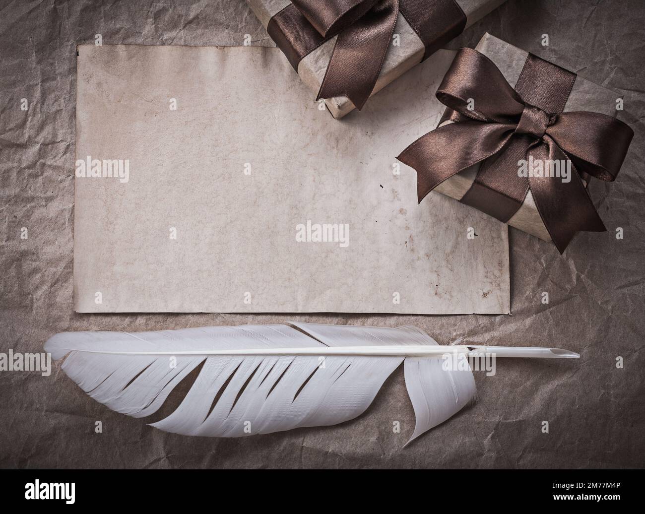 Wrapped present boxes sheet of wrapping paper plume celebration concept ...