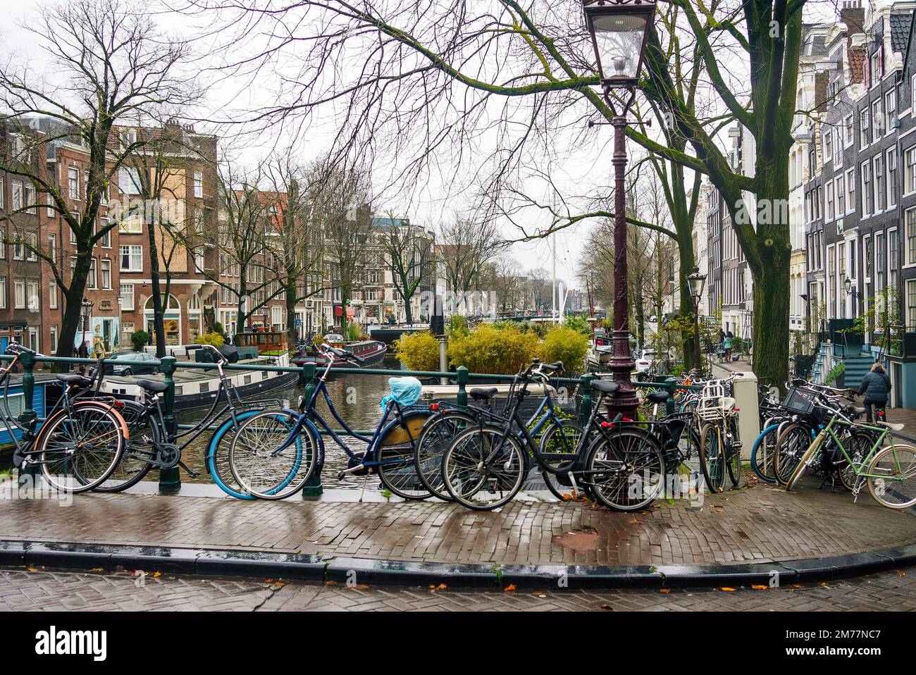 Bicycles parked on a bridge in Amsterdam, The Netherlands Stock Photo ...