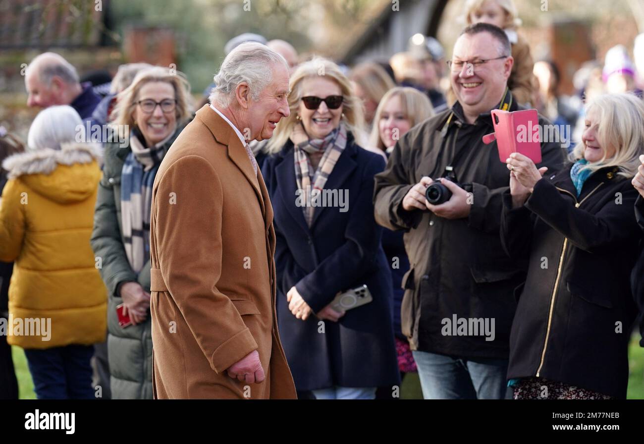 King Charles III speaks to well wishers as he arrives to attend a ...