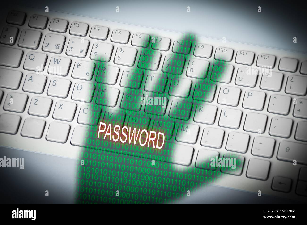 A threatening hand shadow with password on a computer keyboard Stock ...