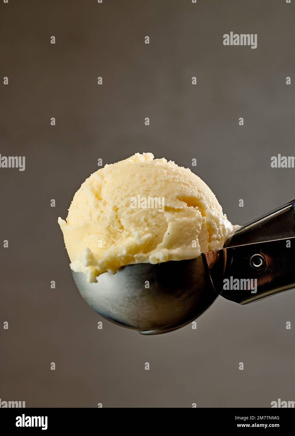 vanilla ice cream ball on dark grey background Stock Photo - Alamy