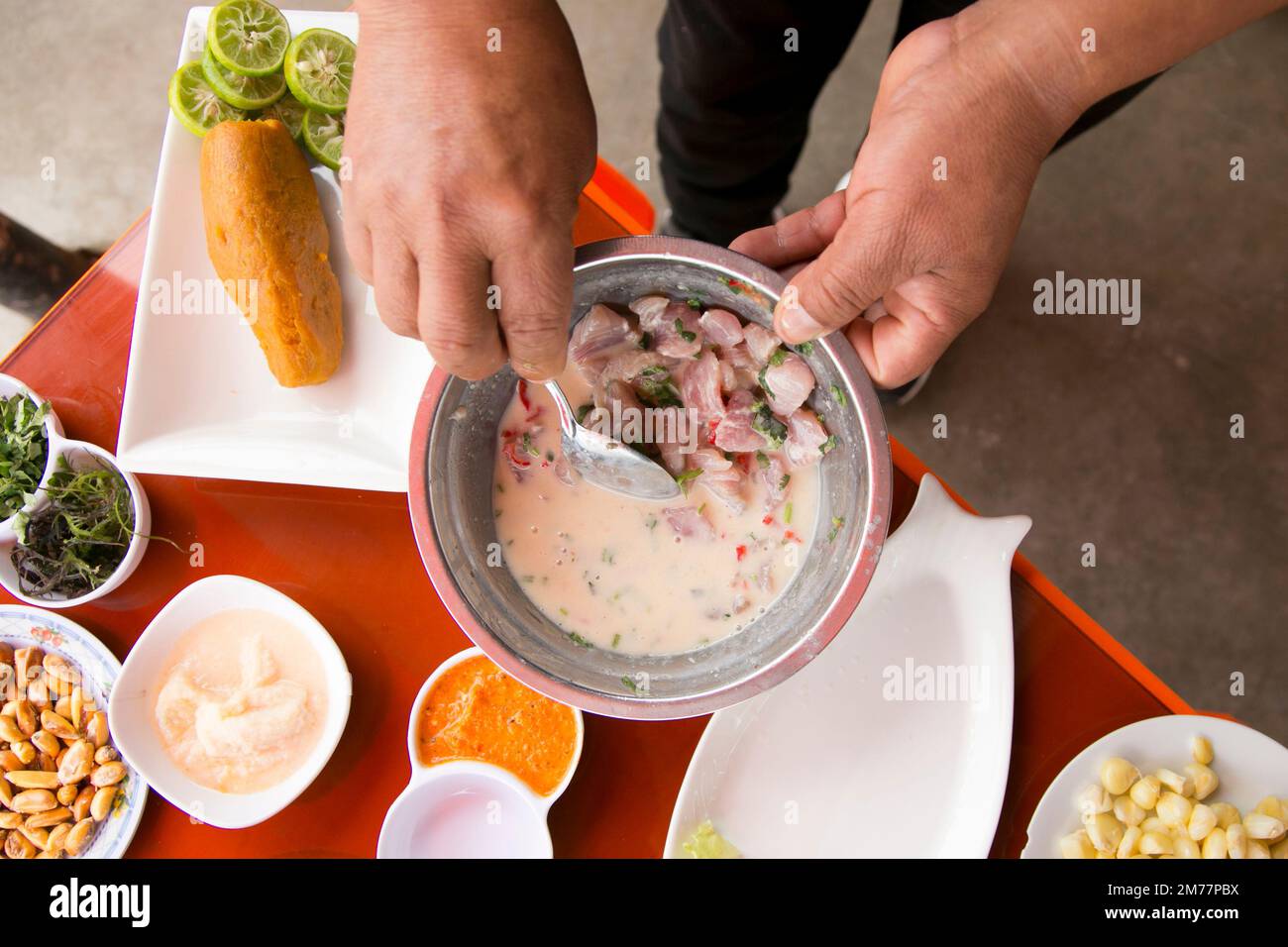 Preparing a delicious Peruvian sea bass ceviche in the fishing port of ...