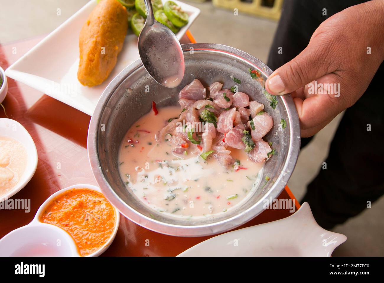 Preparing a delicious Peruvian sea bass ceviche in the fishing port of ...