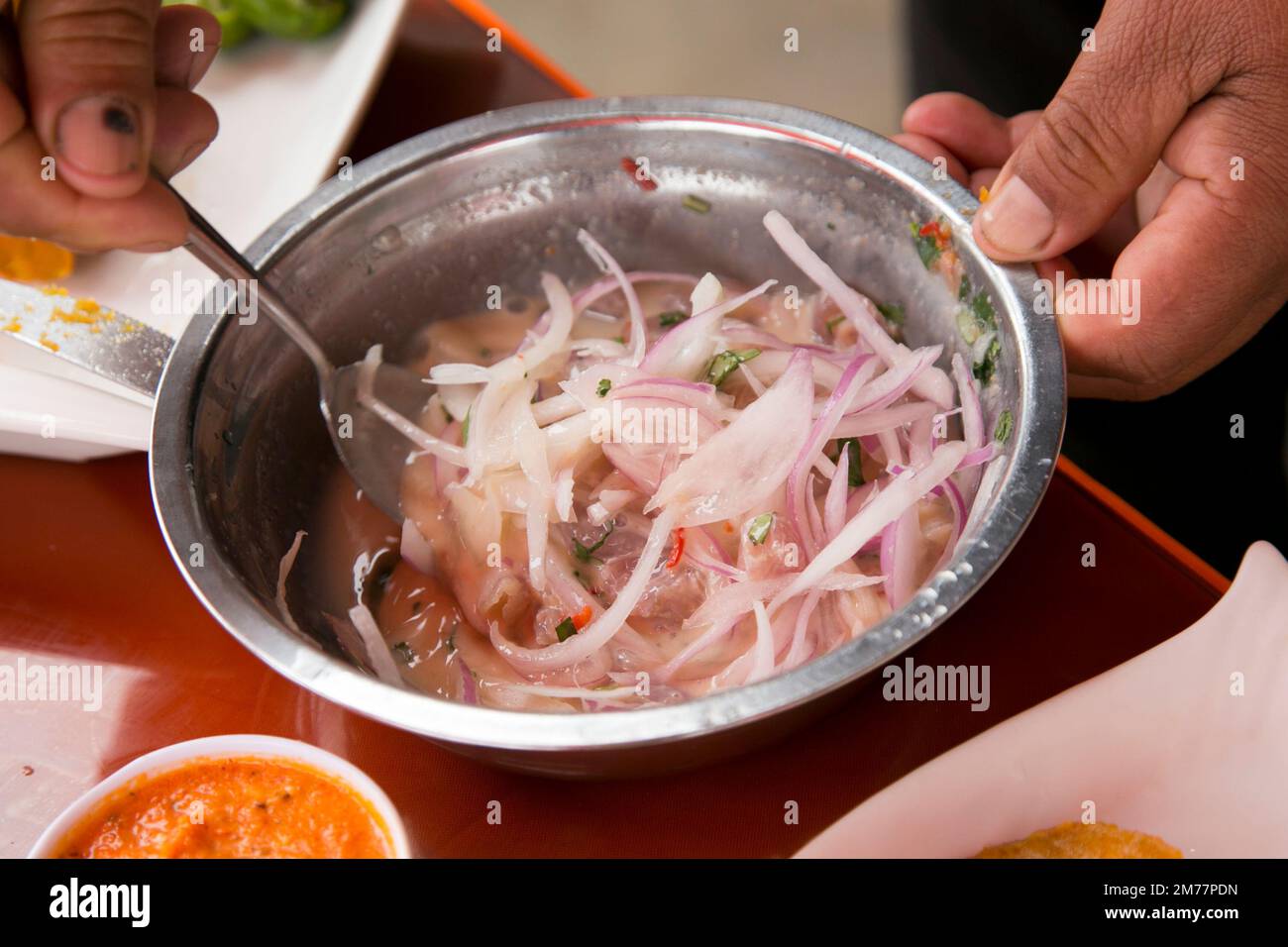 Preparing a delicious Peruvian sea bass ceviche in the fishing port of ...
