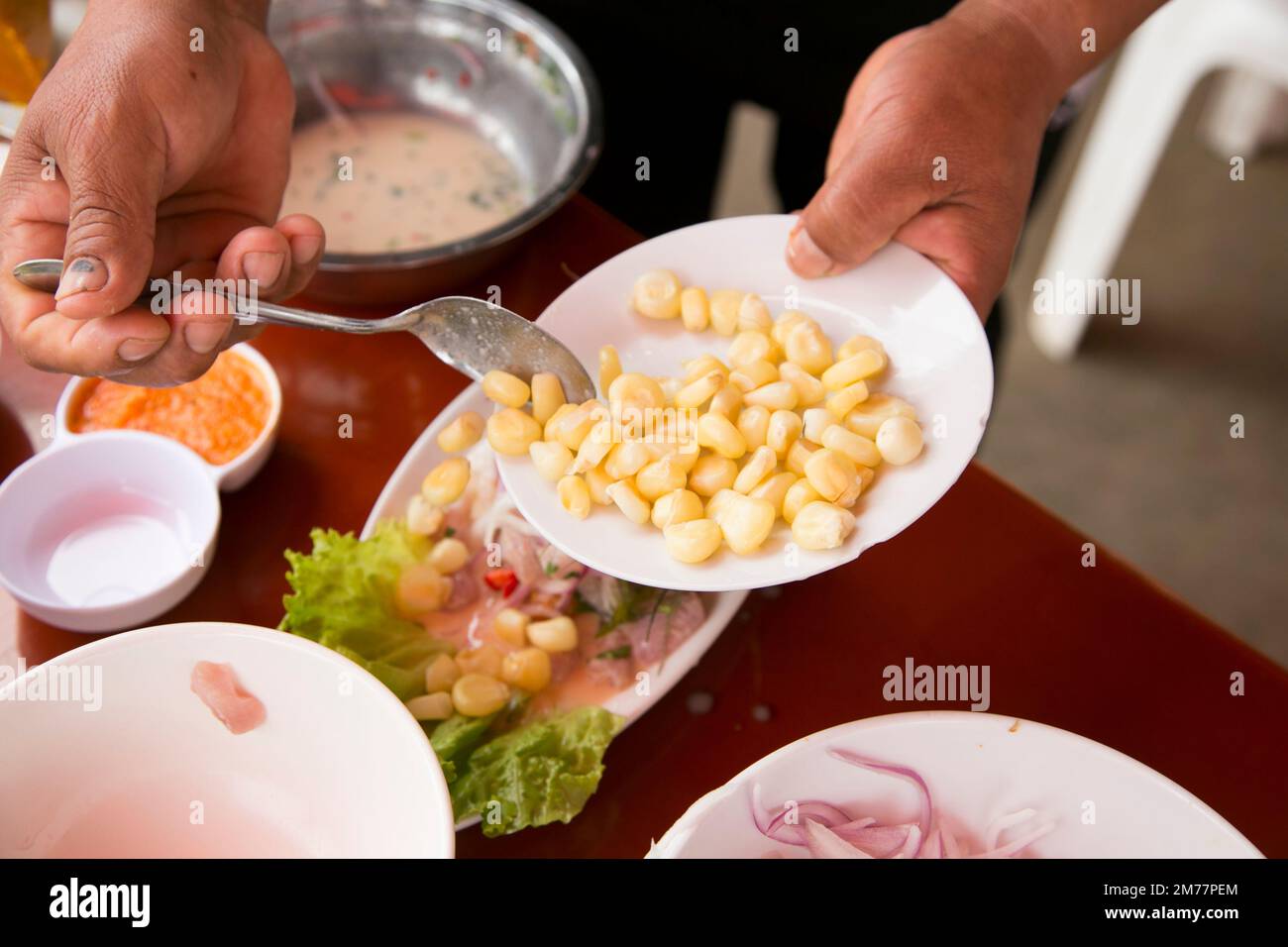 Preparing a delicious Peruvian sea bass ceviche in the fishing port of ...