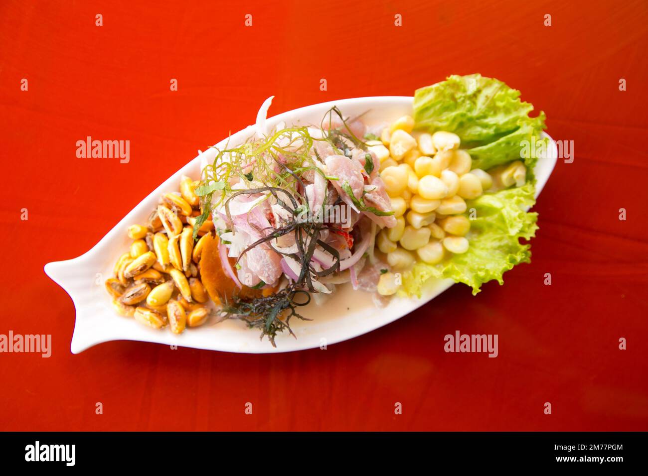 Preparing a delicious Peruvian sea bass ceviche in the fishing port of ...