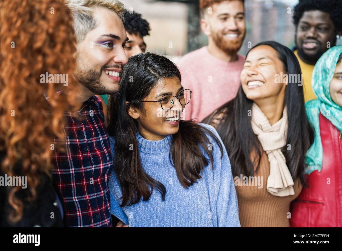 Young diverse people having fun outdoor laughing together - Focus on ...