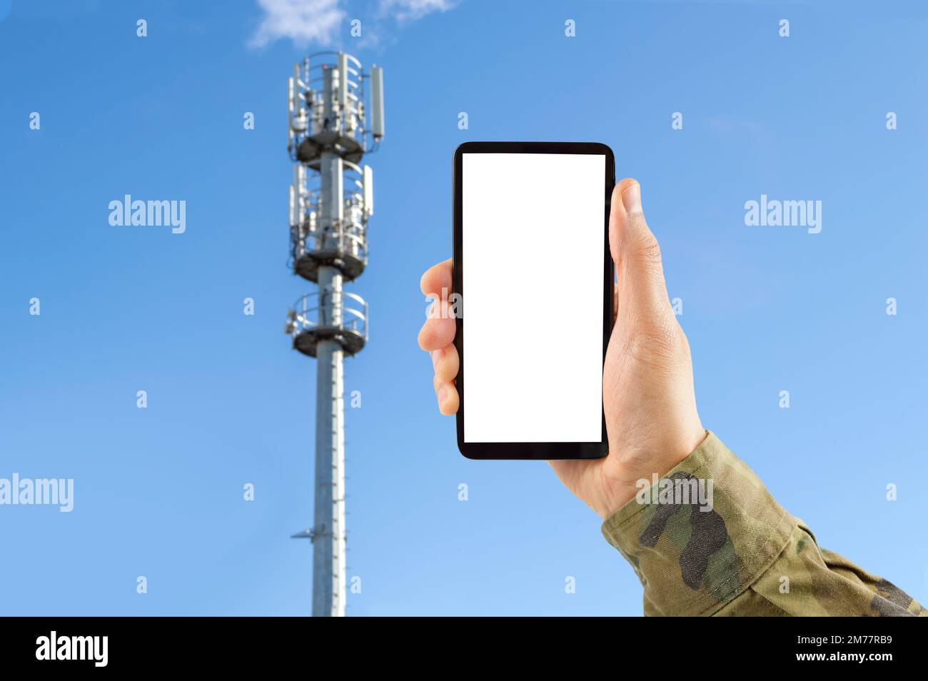 5G military communication tower with man using mobile smart phone Stock ...