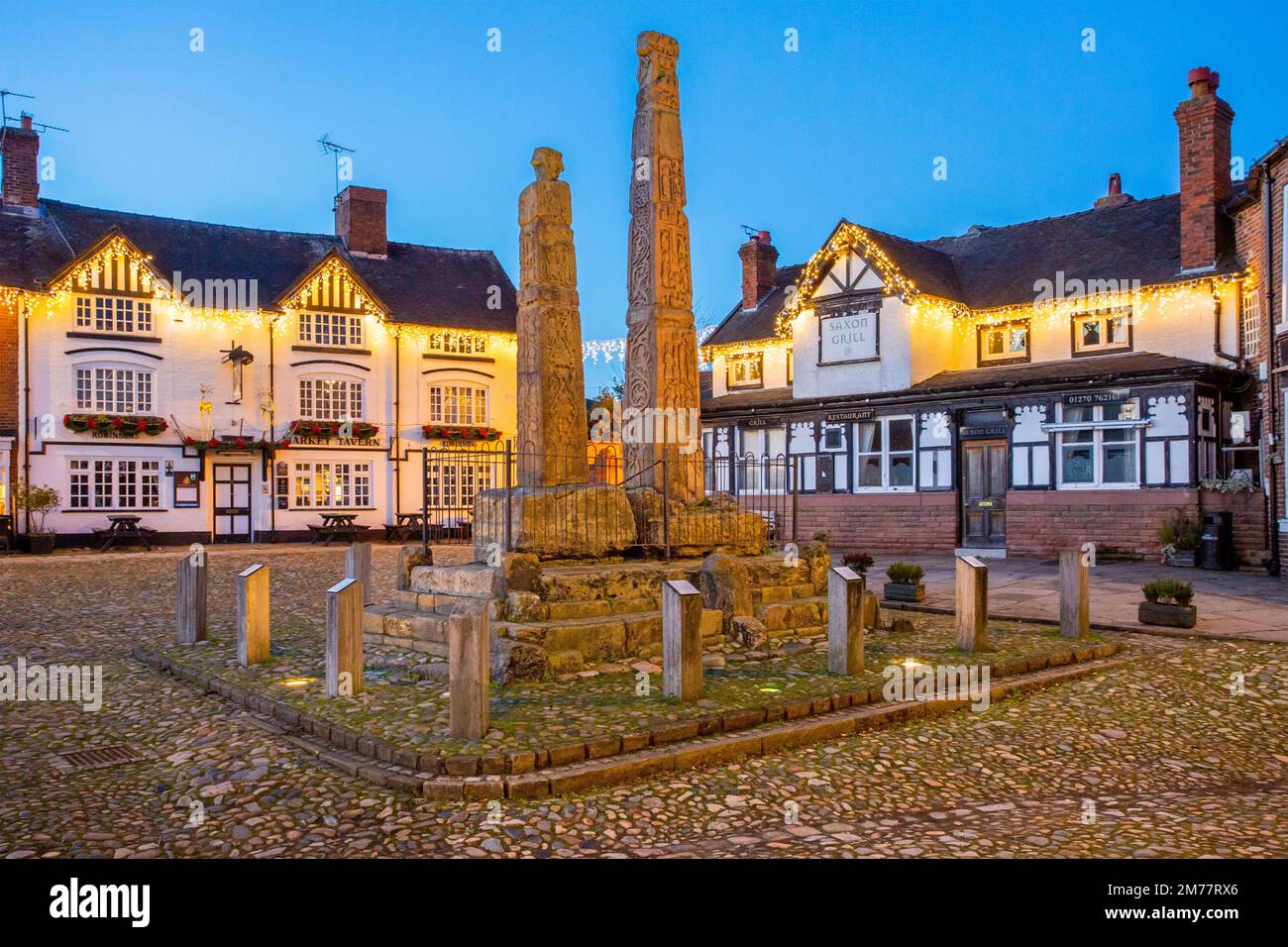 The floodlit ancient cobbled market square in the Cheshire market town ...