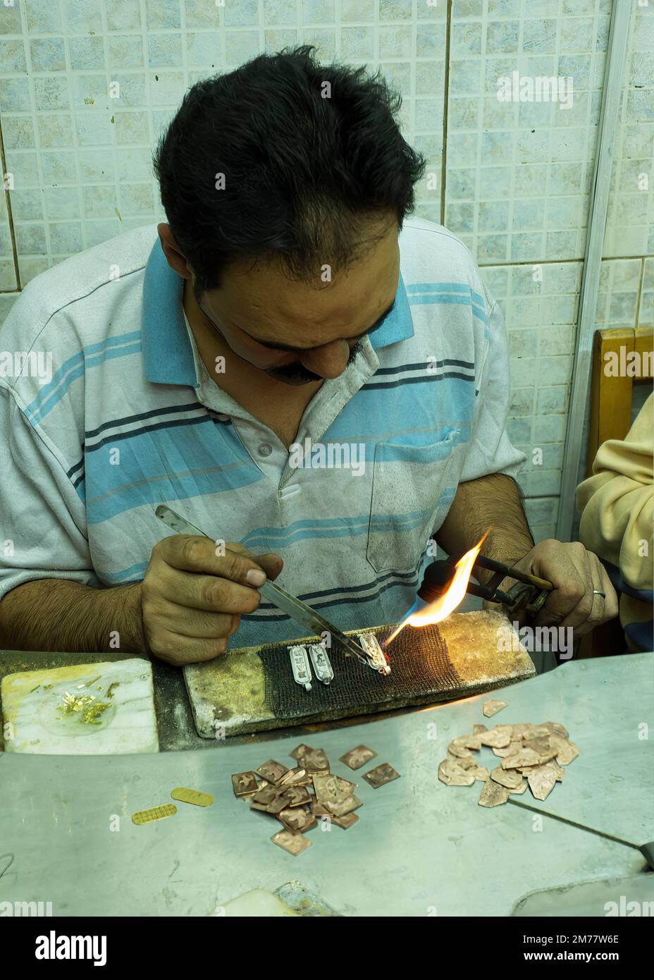 Craftsman making jewellery souvenirs in Old Cairo, Egypt Stock Photo ...