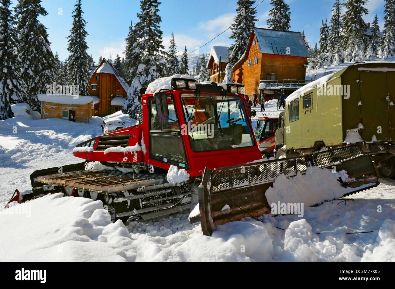 Snowcat on a snow in winter day Stock Photo - Alamy
