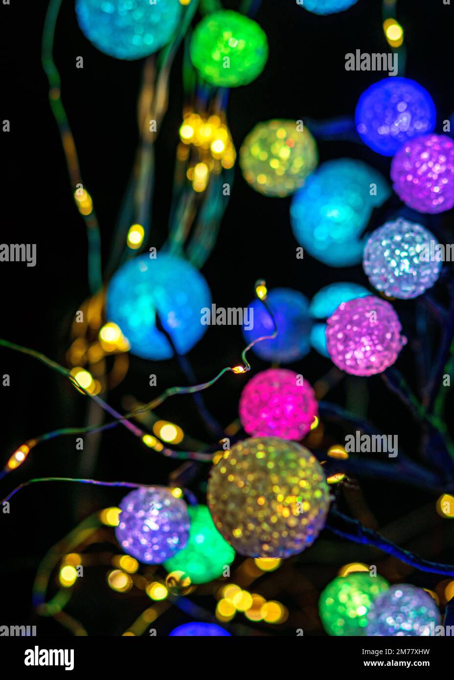 colorful balls of different sizes, bright lights, mixed size of ...