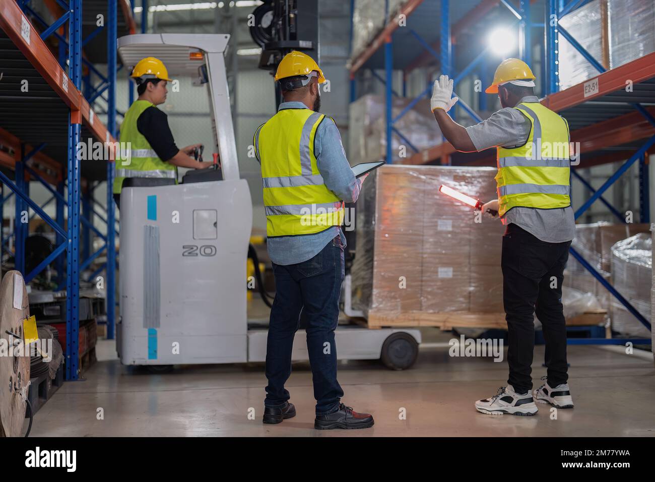 African american working in warehouse hold red light give signal to ...