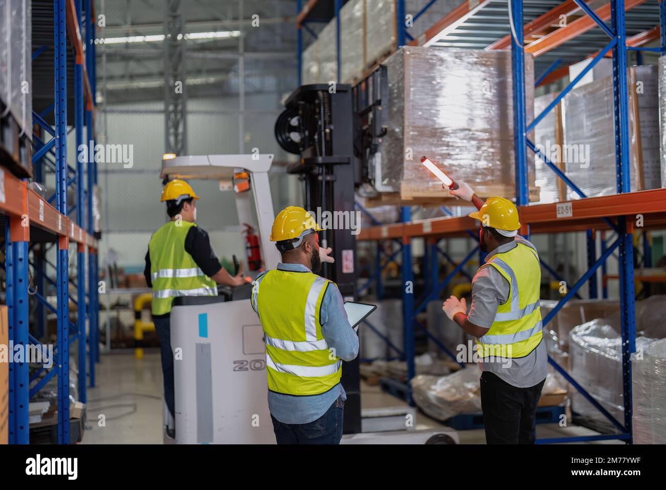 African american working in warehouse hold red light give signal to ...