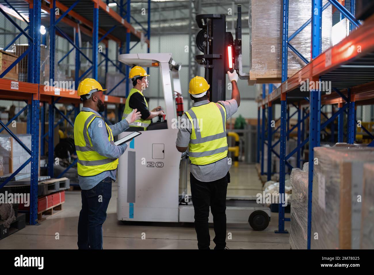 African american working in warehouse hold red light give signal to ...