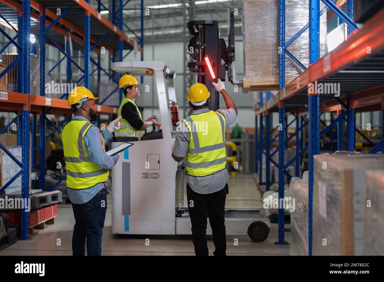African american working in warehouse hold red light give signal to ...