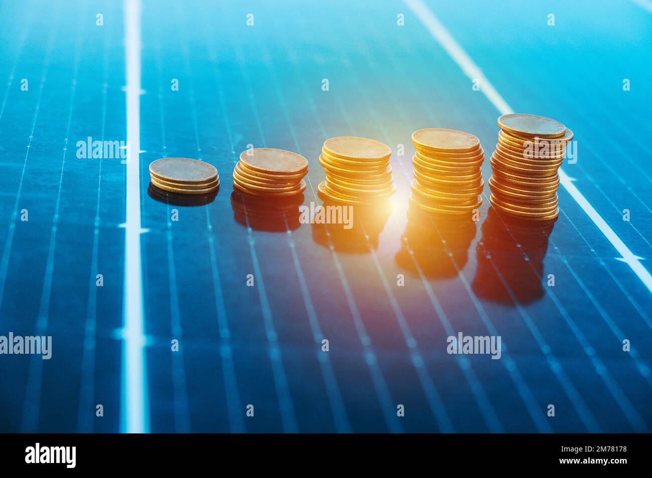 Money saved by using energy with solar panel Stock Photo - Alamy