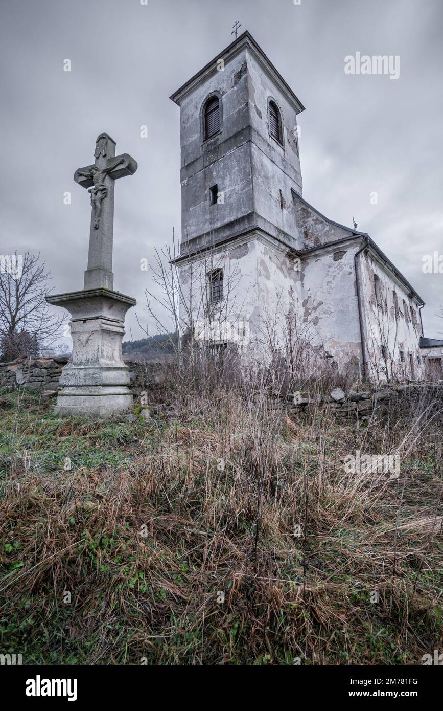 Vertical shot of old Church of Saint John of Nepomuk falling apart on a ...