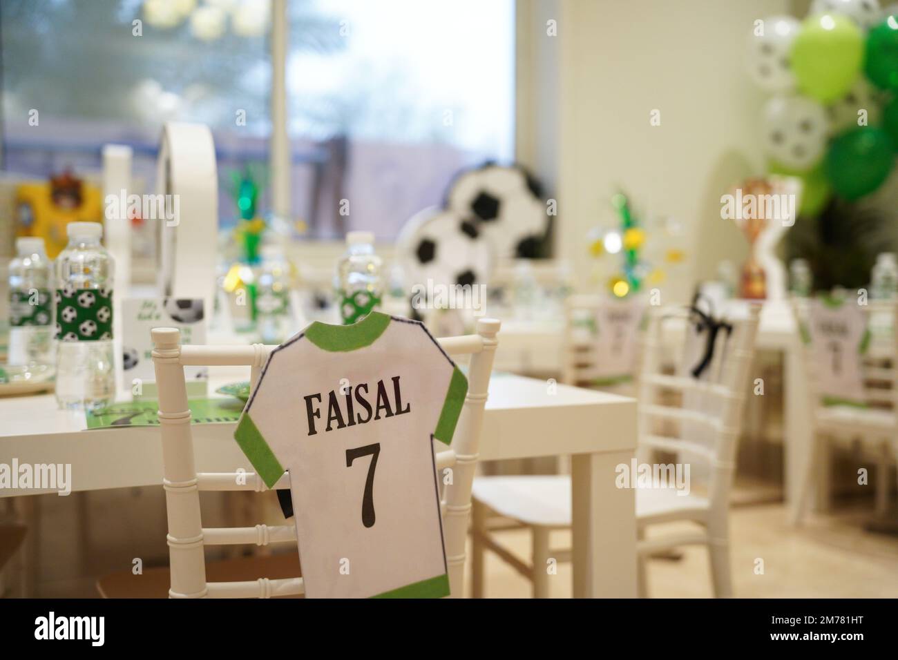Kids' soccer or football-themed party table with plastic cutlery and ...