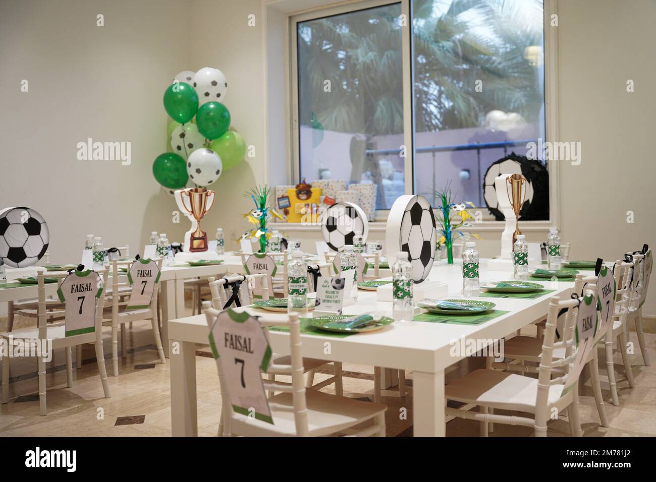 Kids' soccer or football-themed party table with plastic cutlery and ...