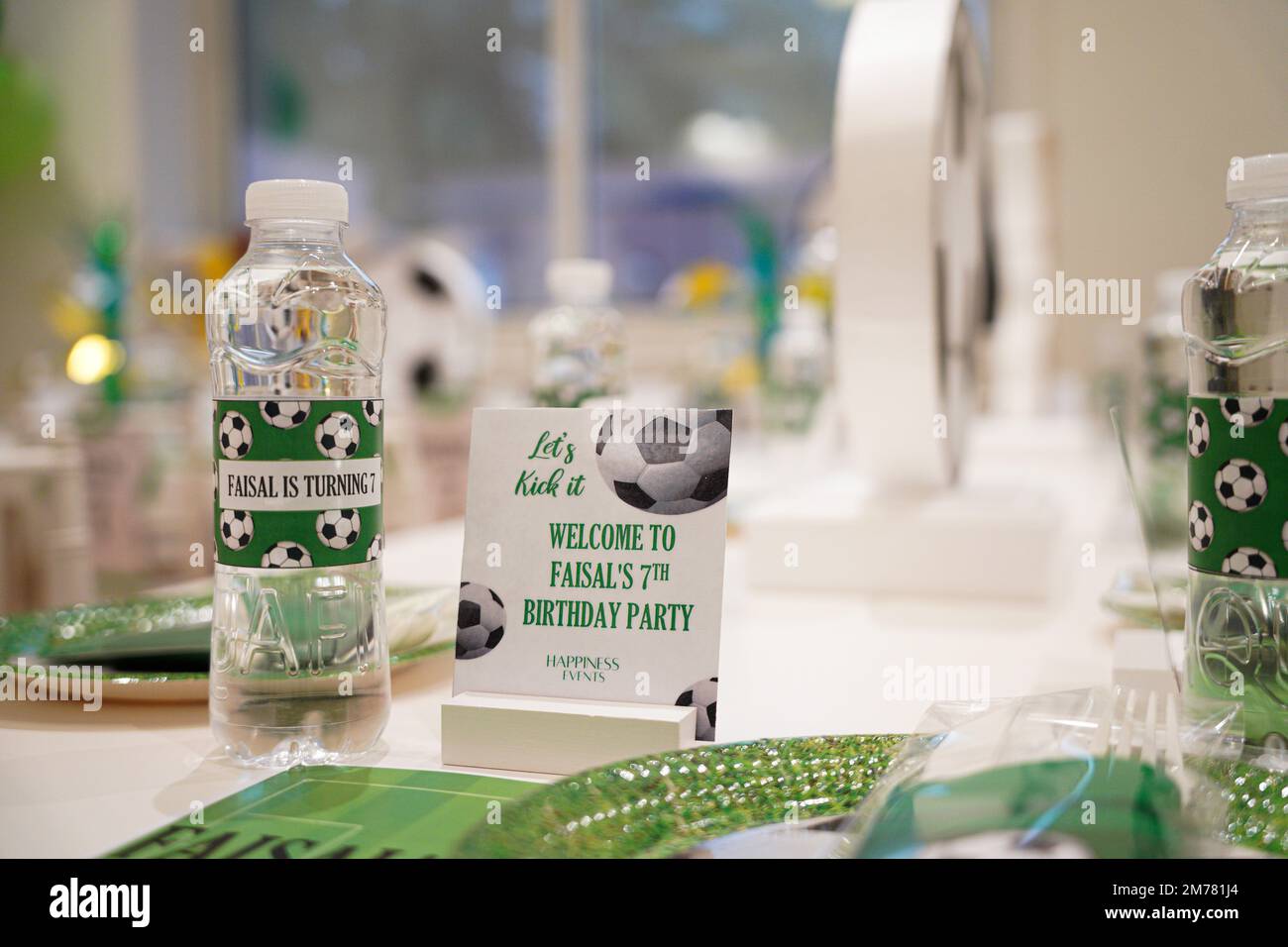 Kids' soccer or football-themed party table with plastic cutlery and ...