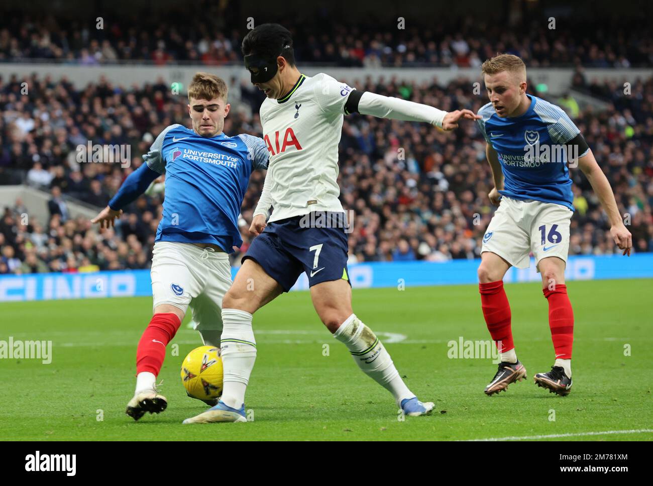 L-R Zak Swanson of Portsmouth and Tottenham Hotspur's Heung-Min Son and ...
