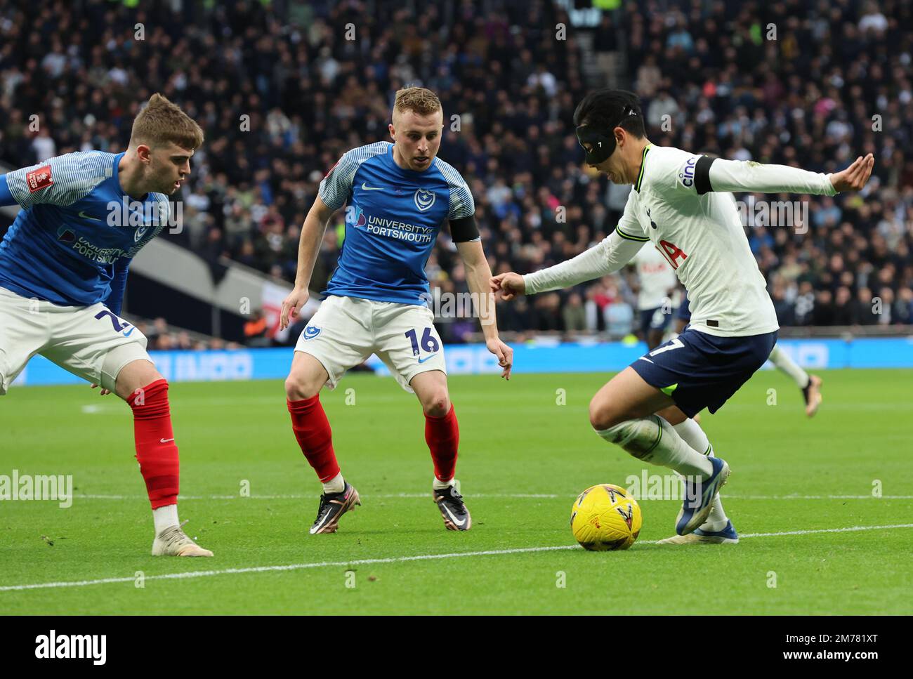 L-R Zak Swanson of Portsmouth and Tottenham Hotspur's Heung-Min Son and ...