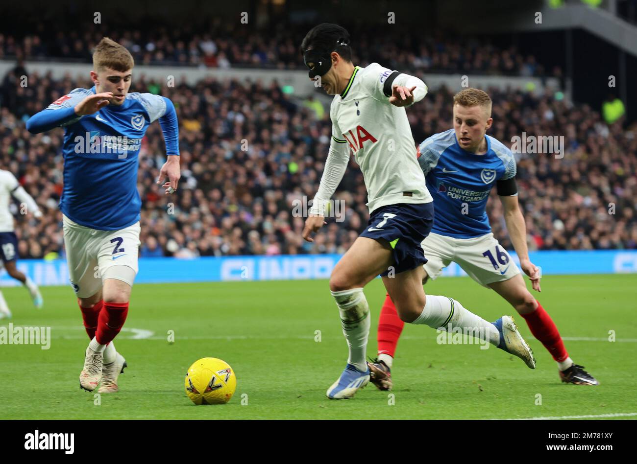 L-R Zak Swanson of Portsmouth and Tottenham Hotspur's Heung-Min Son and ...