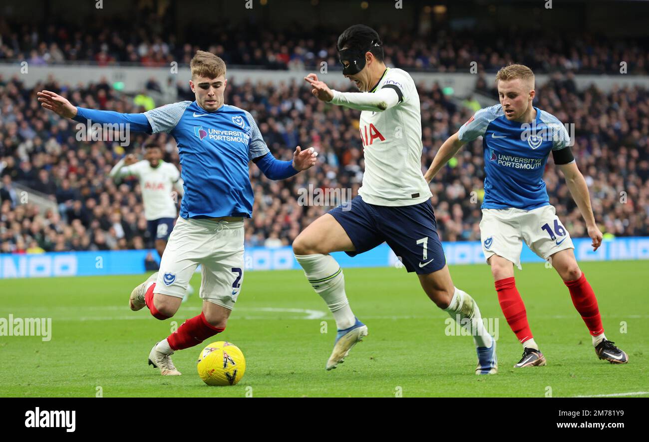 L-R Zak Swanson of Portsmouth and Tottenham Hotspur's Heung-Min Son and ...