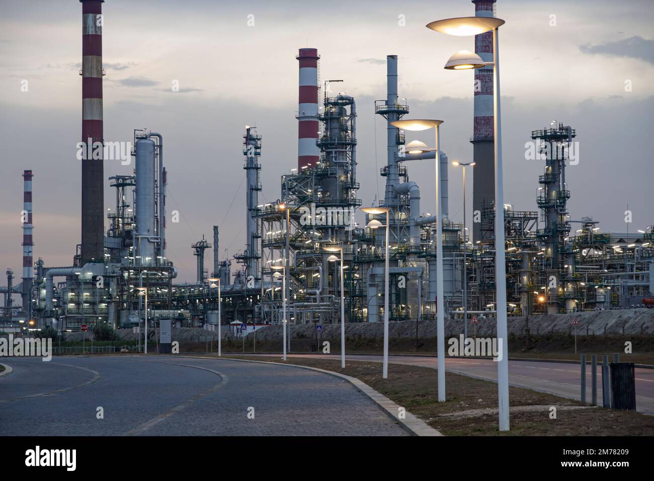 Big oil refinery near a city street at dawn. Photo from 2011 Stock ...