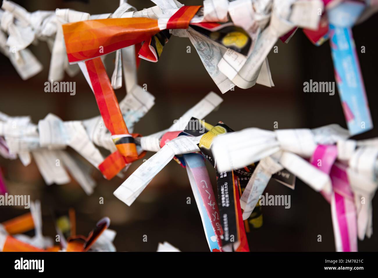 A fortune telling slip at Tomioka Shrine closeup Stock Photo - Alamy