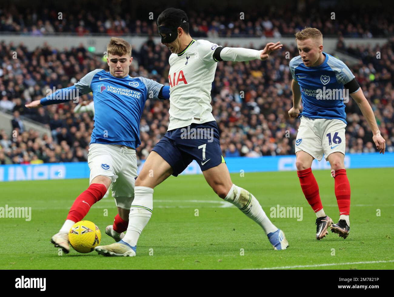 L-R Zak Swanson of Portsmouth and Tottenham Hotspur's Heung-Min Son and ...