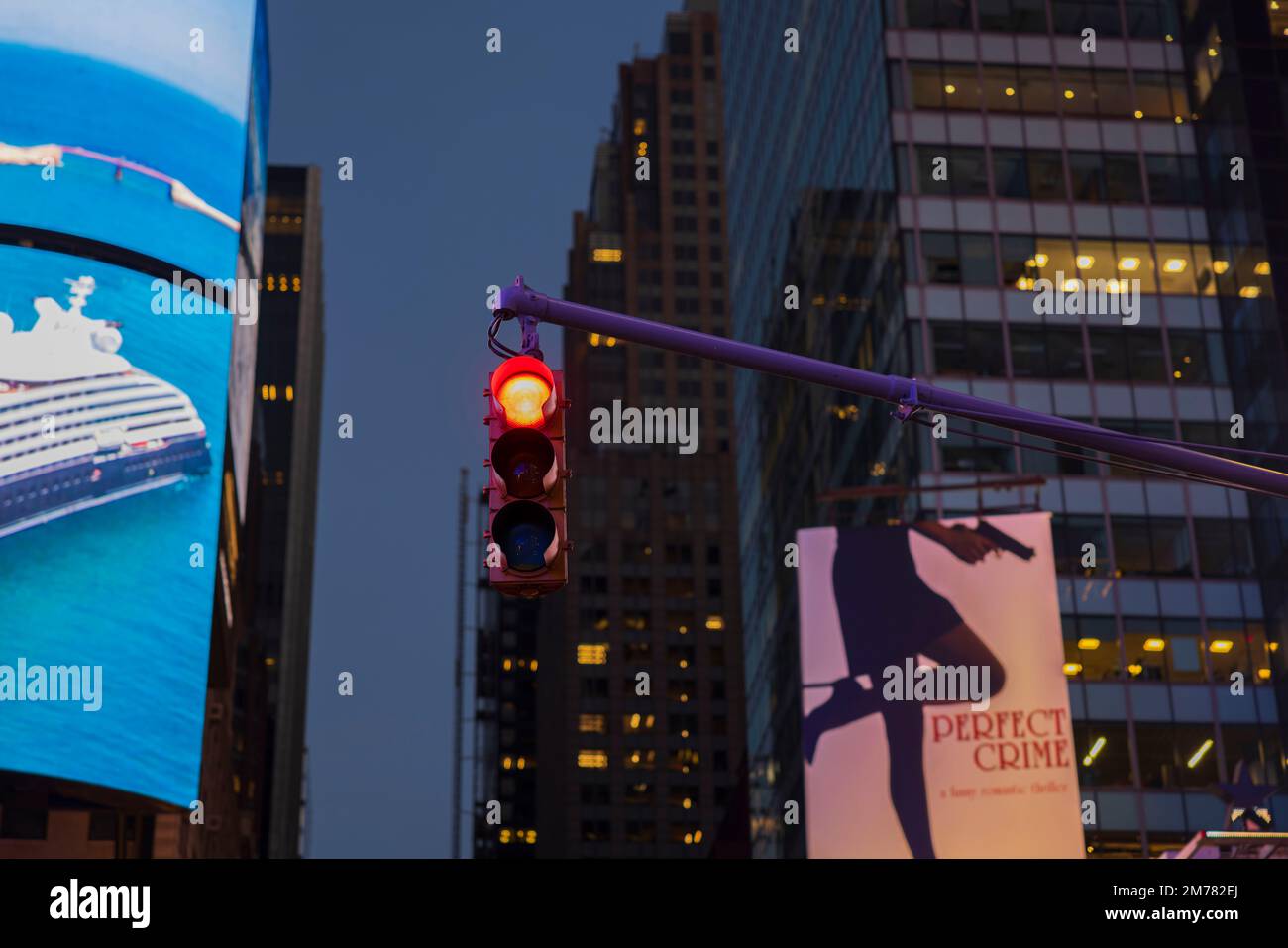 Close up view of red traffic light at night on Broadway in Manhattan ...
