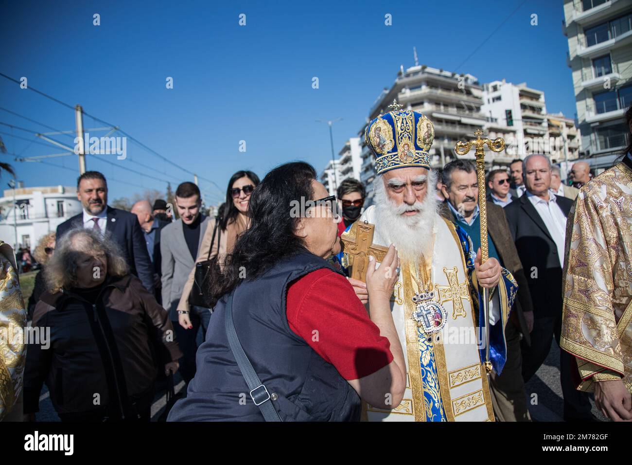 Athens, Greece. 06th Jan, 2023. A woman kisses a wooden cross after the ...