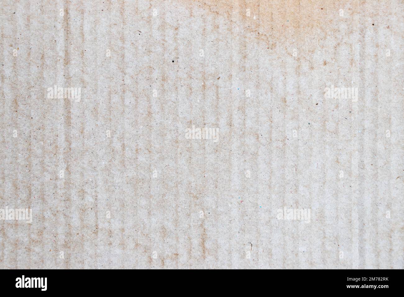 Water stained on brown corrugated packaging material background with ...
