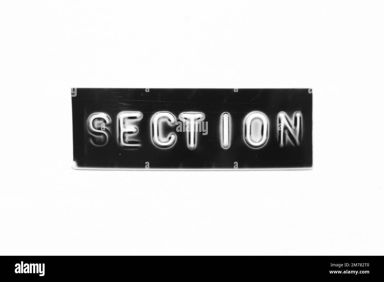 Black color banner that have embossed letter with word section on white ...