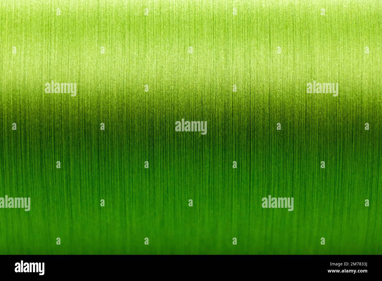 Closed up of green color of thread textured background (Focus at center ...