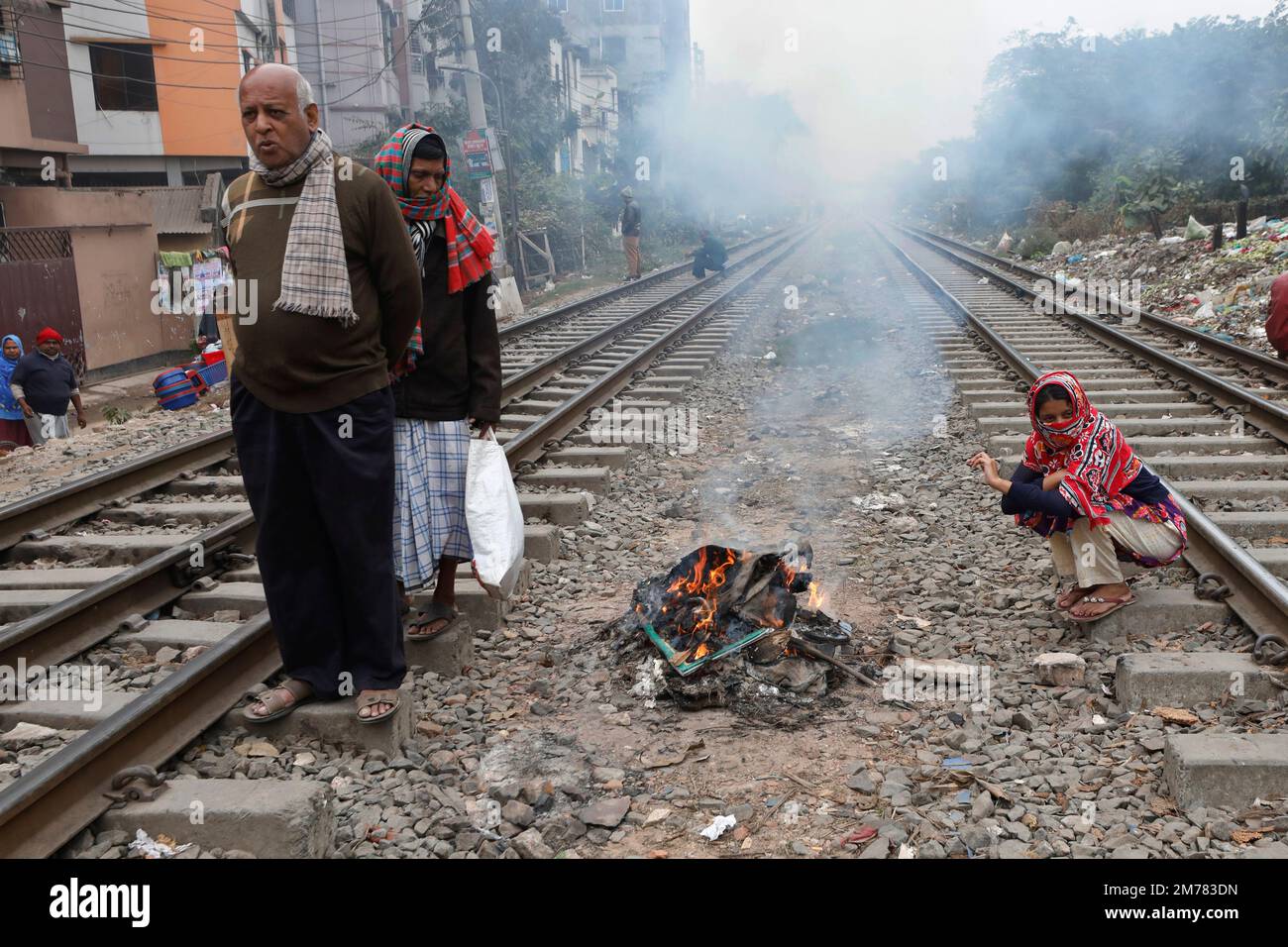 Dhaka, Bangladesh - January 08, 2023: People are burning fire at ...