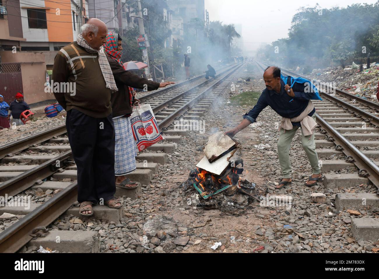Dhaka, Bangladesh - January 08, 2023: People are burning fire at ...