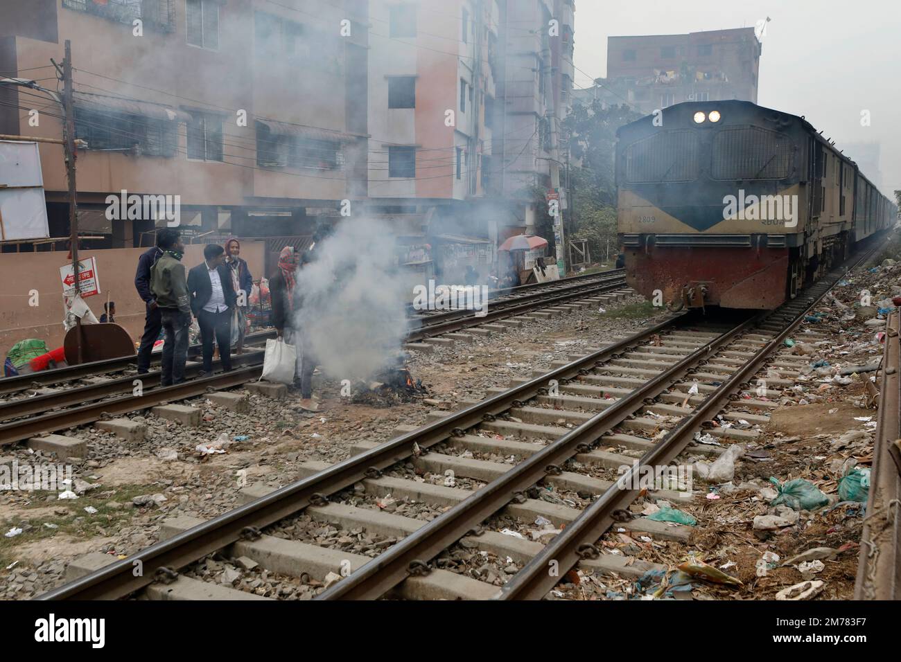 Dhaka, Bangladesh - January 08, 2023: People are burning fire at ...