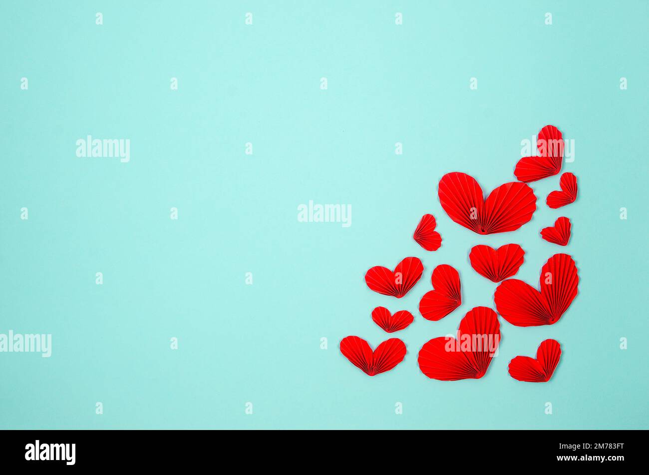 Many various red paper hearts on blue background. Concept of Valentine ...