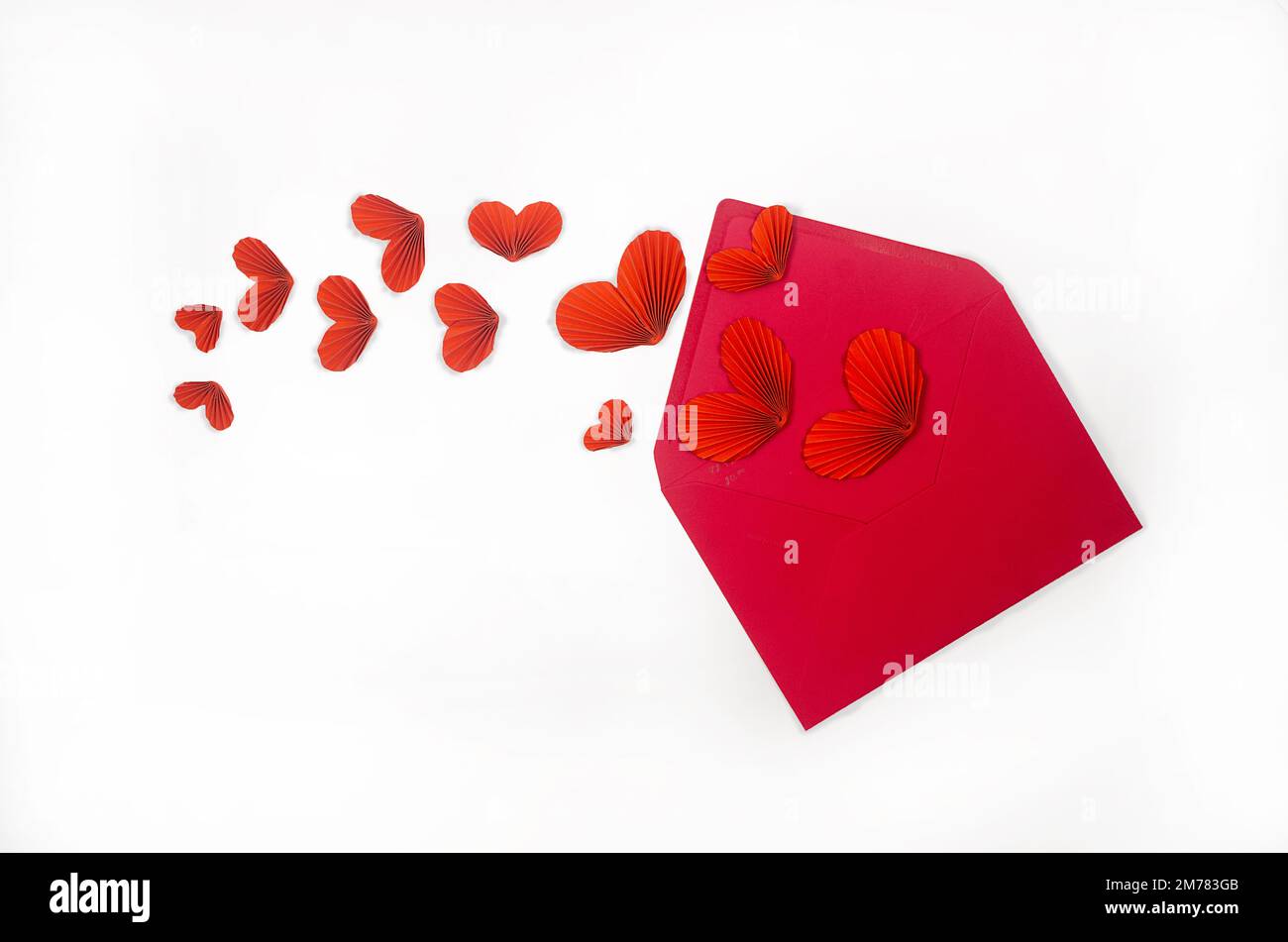 Red envelope and various red hearts on white background. Concept of ...