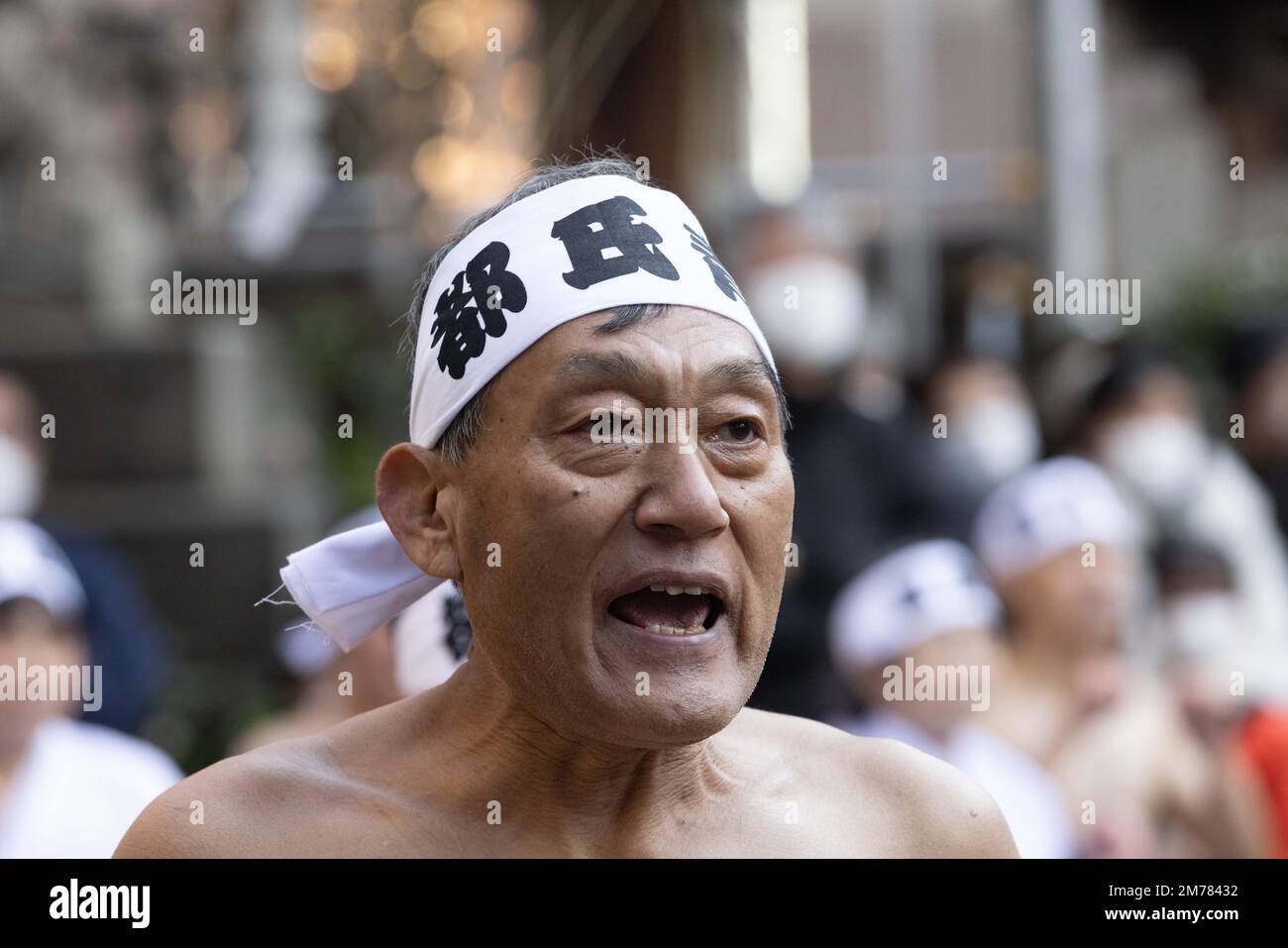 Participant of the 68th Teppozu Inari Shrine Kanchu Suiyoku event sings ...