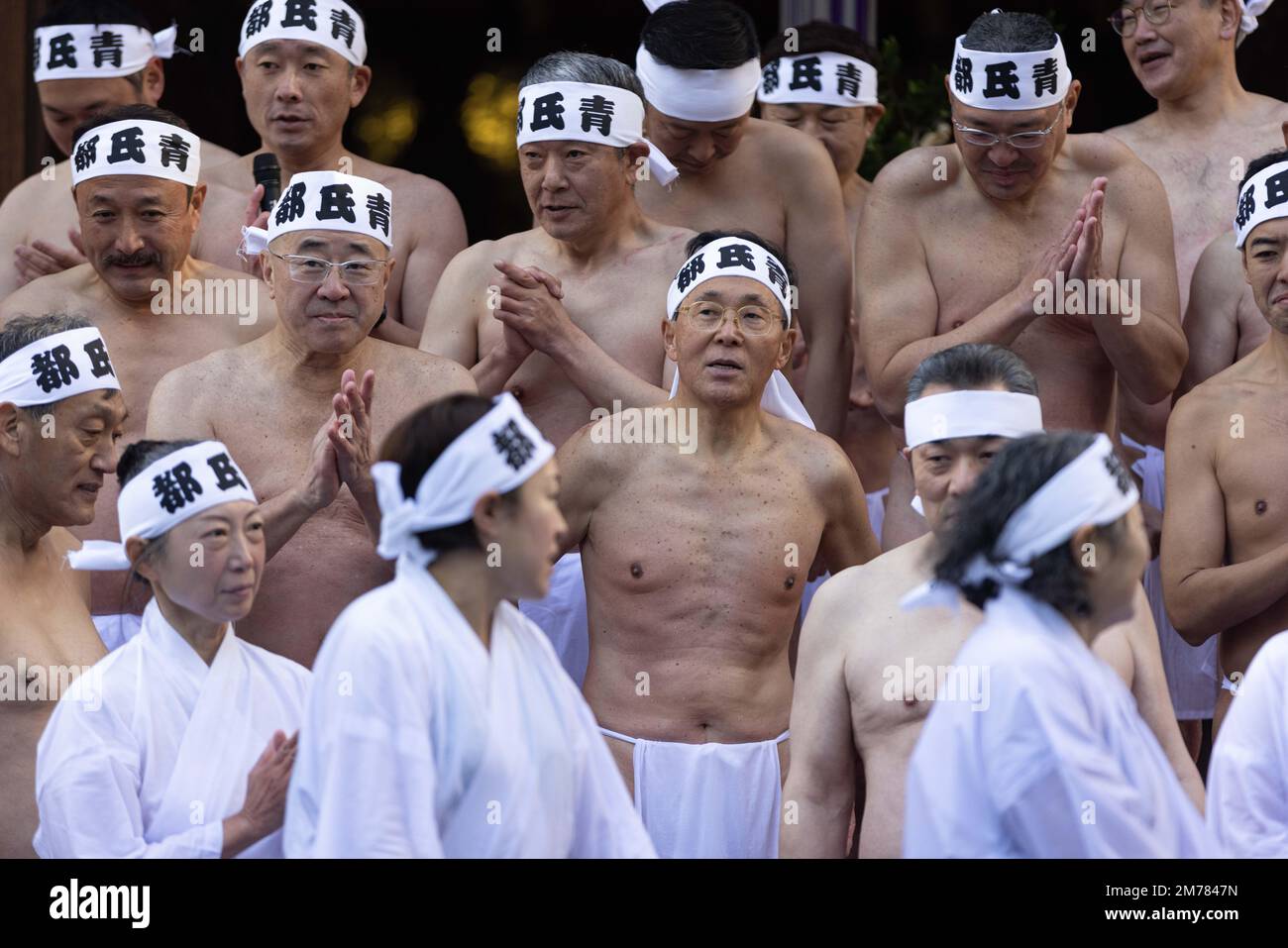 Participants of the 68th Teppozu Inari Shrine Kanchu Suiyoku event ...