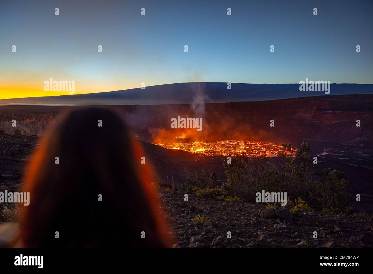 Volcano, HI, USA. 7th Jan, 2023. Spectators observe the eruption ...